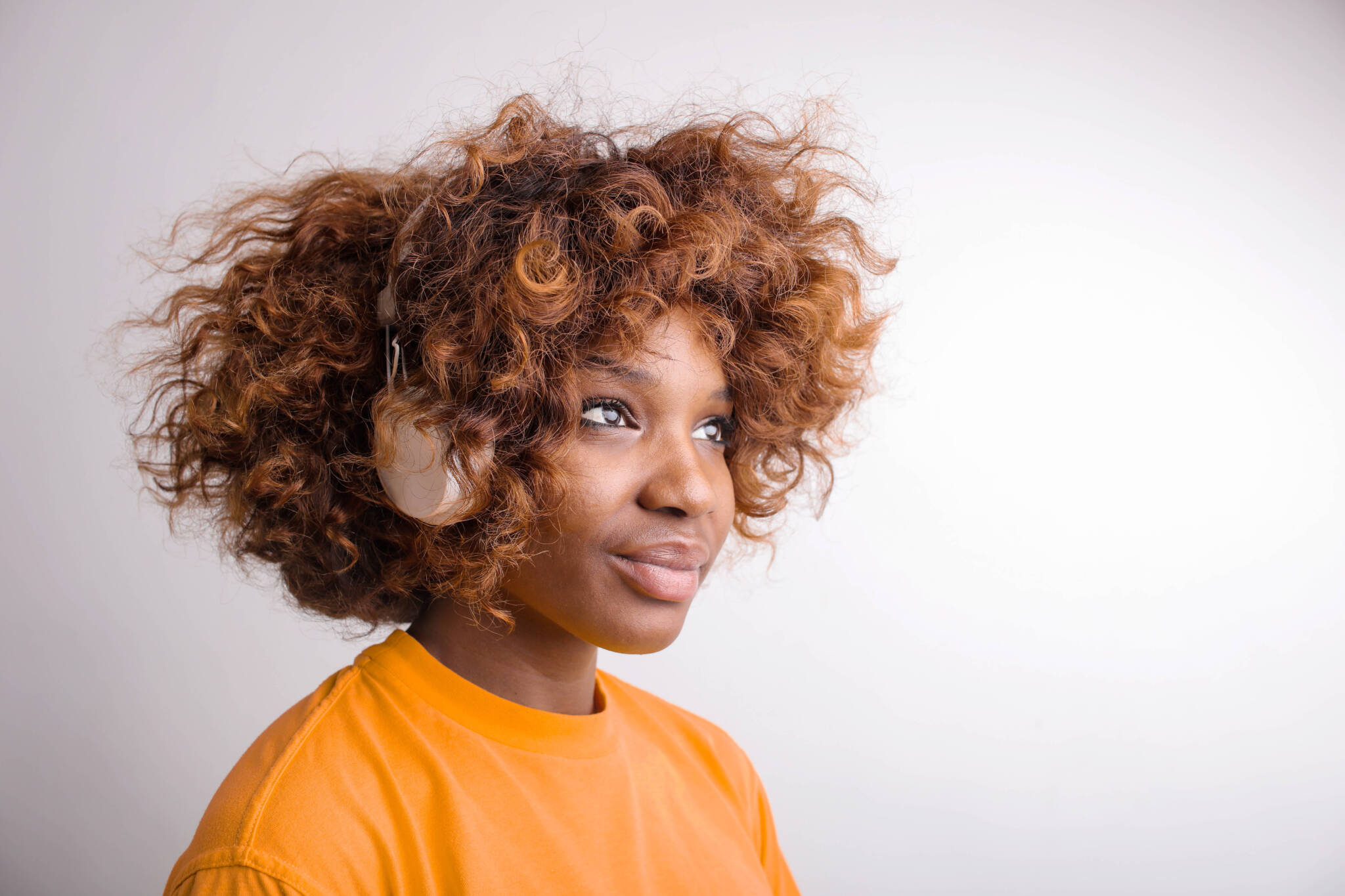 Cortes de pelo rizado para una cara alargada